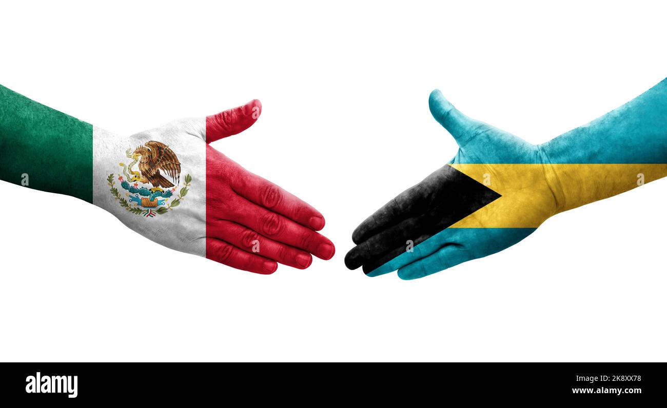 Handshake between Bahamas and Mexico flags painted on hands, isolated ...