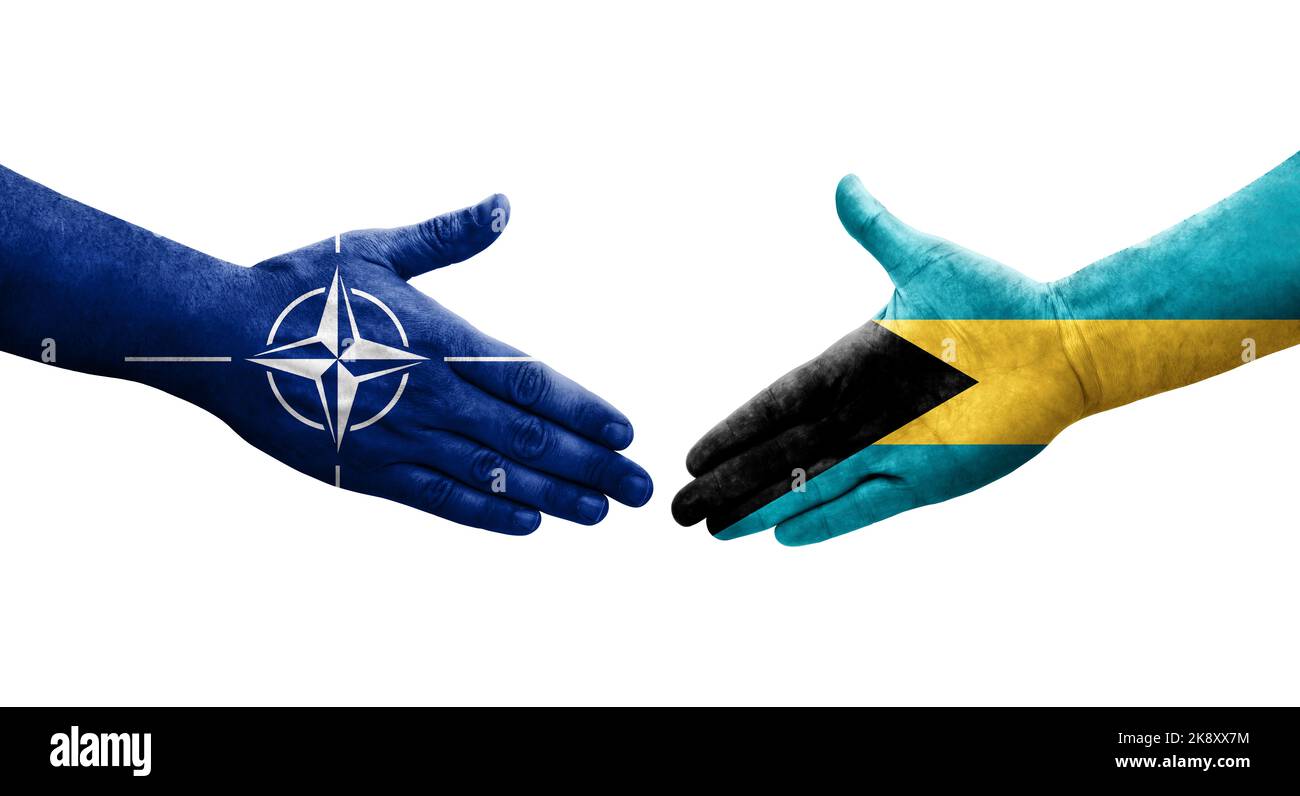 Handshake between Bahamas and Nato flags painted on hands, isolated ...