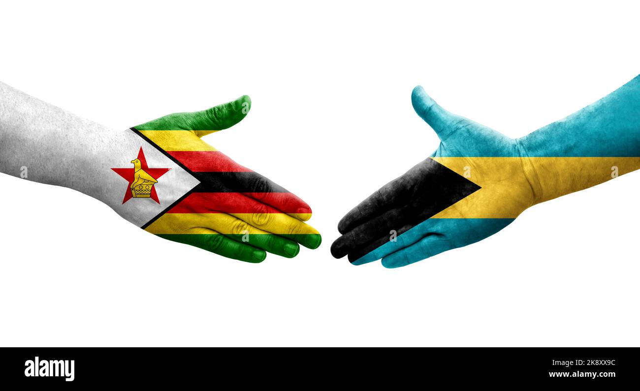 Handshake between Bahamas and Zimbabwe flags painted on hands, isolated ...