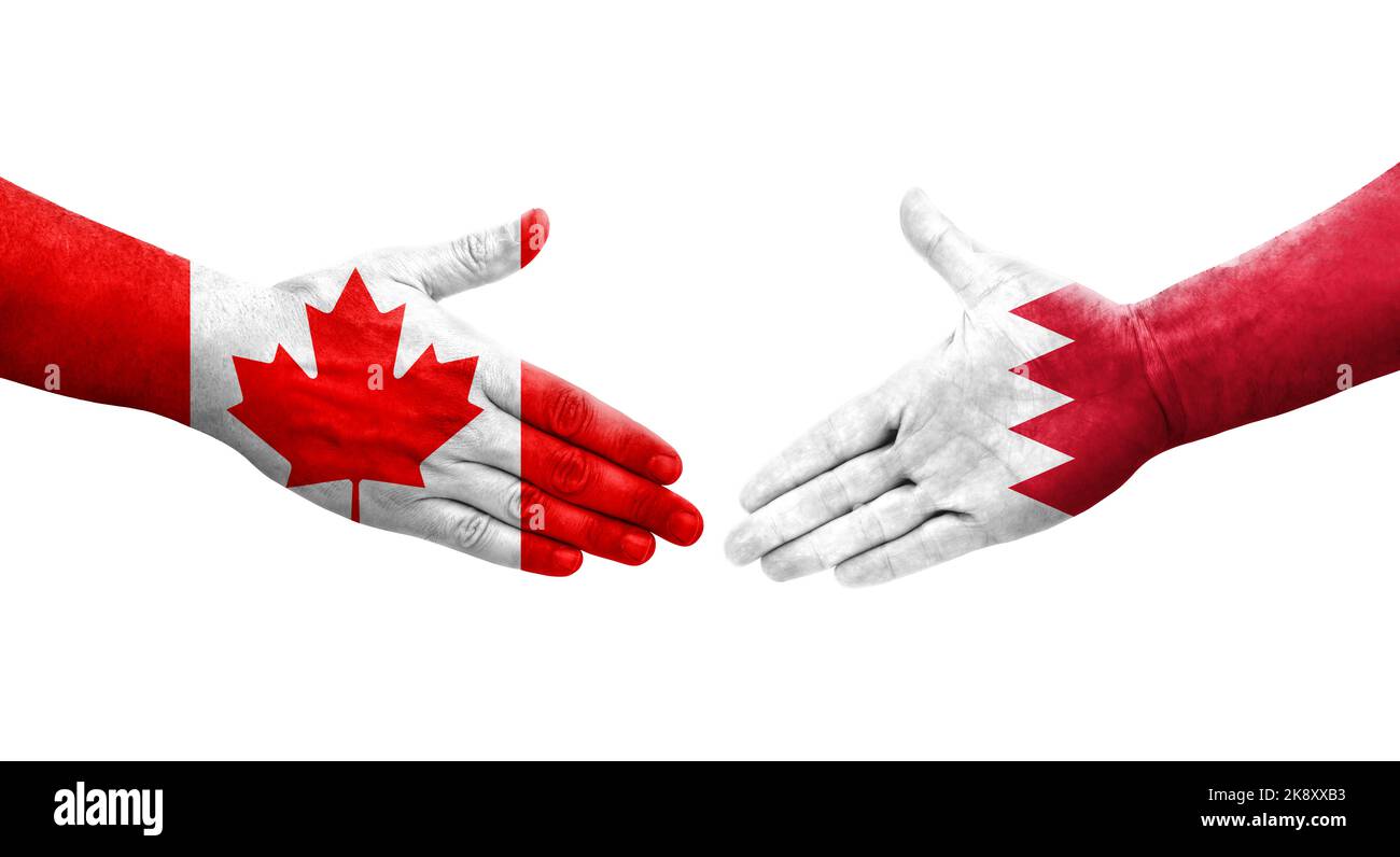 Handshake between Bahrain and Canada flags painted on hands, isolated ...