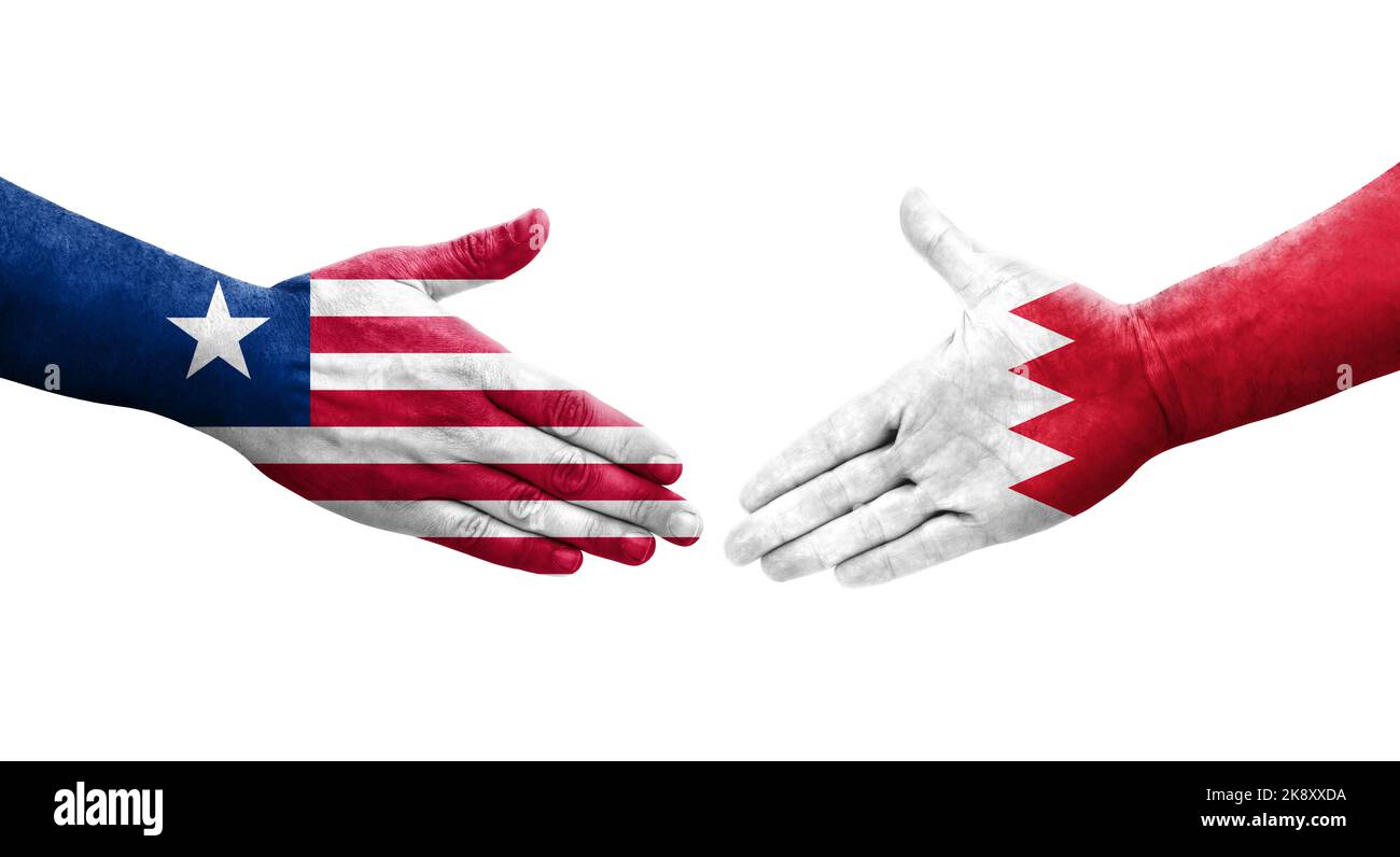 Handshake between Bahrain and Liberia flags painted on hands, isolated ...