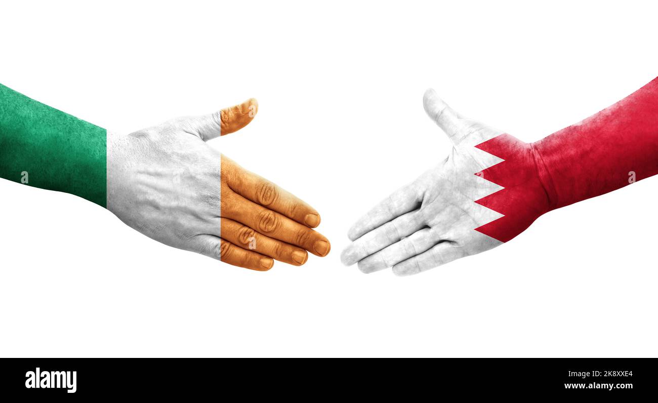 Handshake between Bahrain and Ireland flags painted on hands, isolated ...