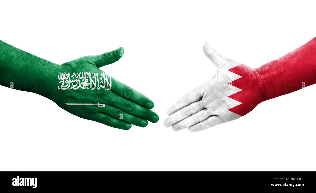 Handshake between Bahrain and Saudi Arabia flags painted on hands ...