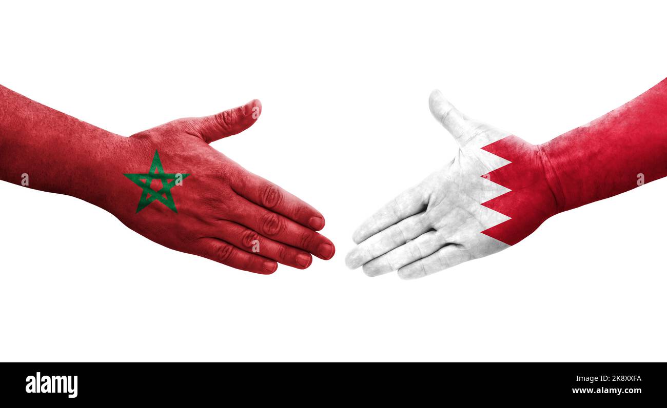 Handshake between Bahrain and Morocco flags painted on hands, isolated ...