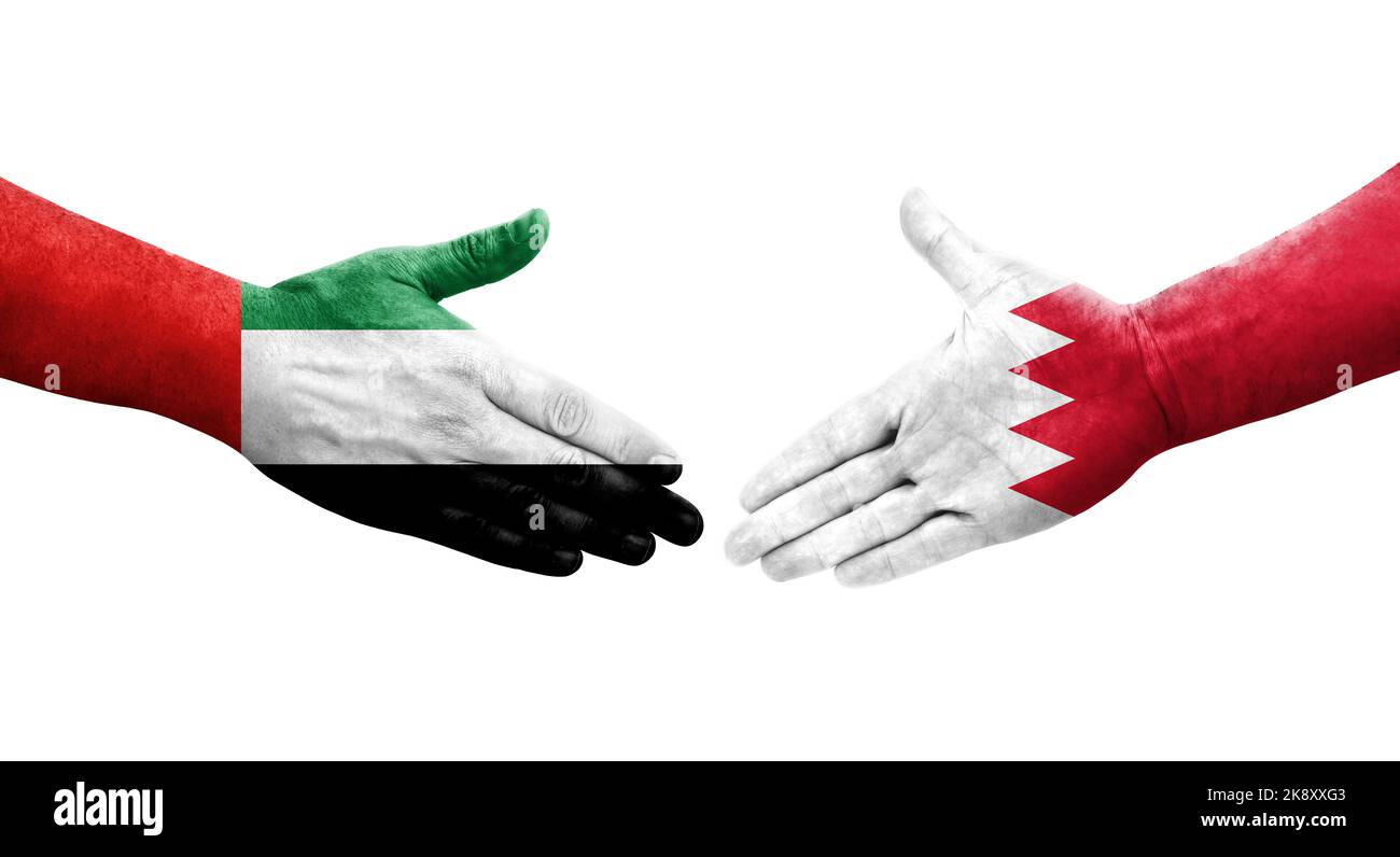Handshake between Bahrain and UAE flags painted on hands, isolated ...