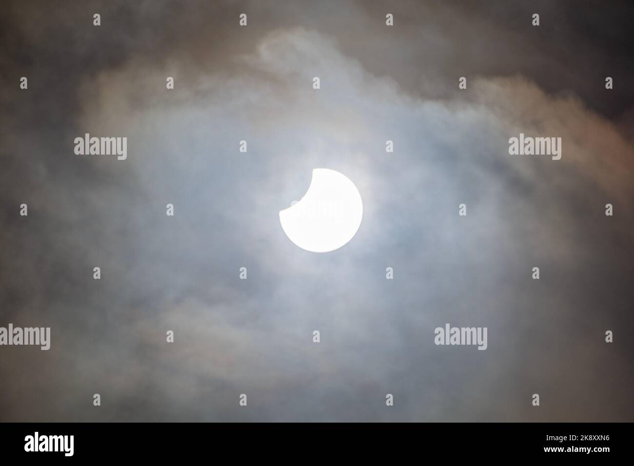 Partial Solar Eclipse With Light Cloud Cover On October 25 2022 In