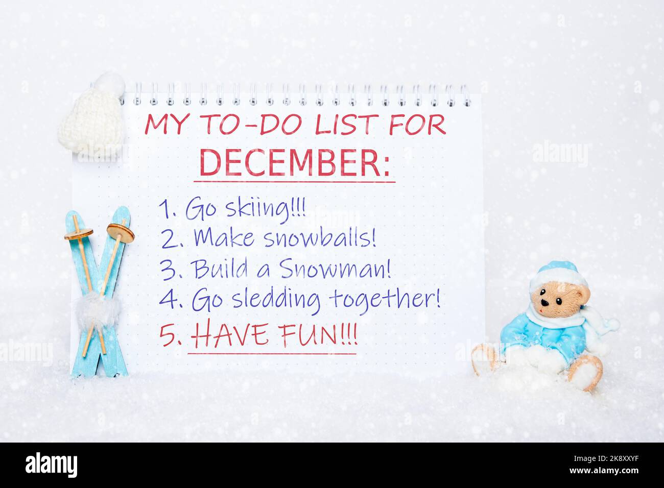 My December to-do list. Notepad with a to-do list: skiing, making ...
