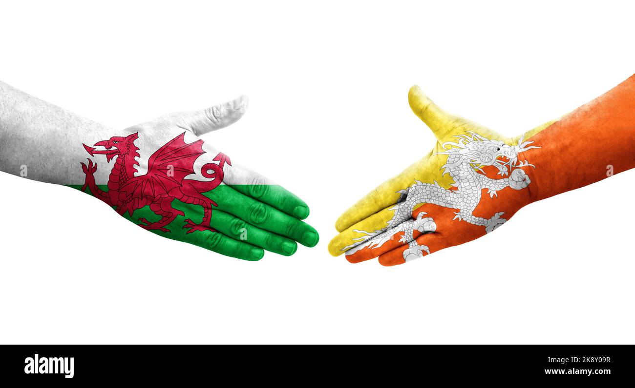 Handshake between Bhutan and Wales flags painted on hands, isolated ...