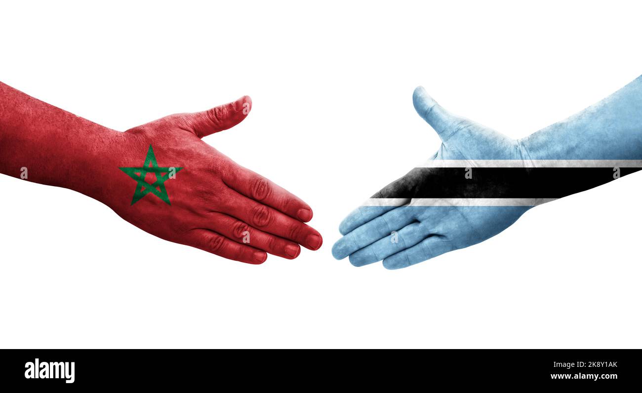 Handshake between Botswana and Morocco flags painted on hands, isolated ...