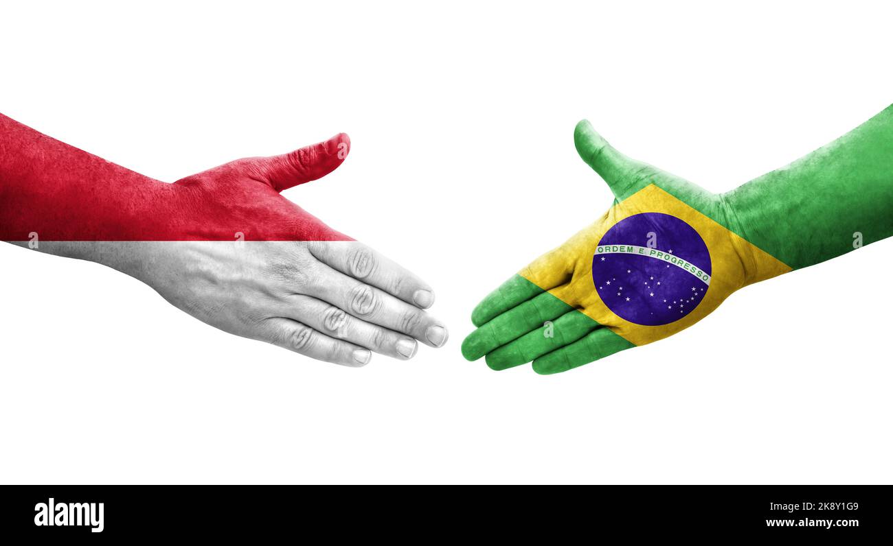 Handshake between Brazil and Monaco flags painted on hands, isolated ...