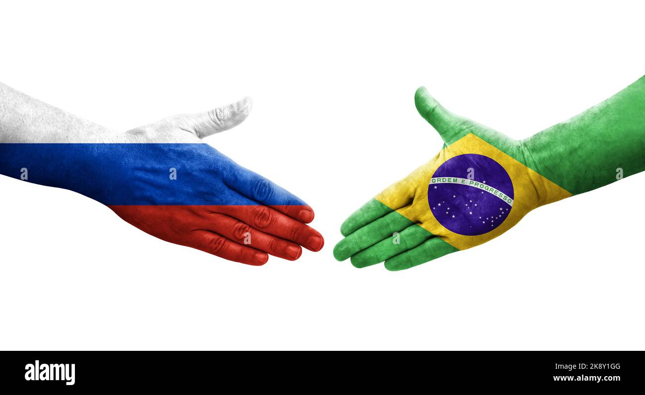 Handshake between Brazil and Russia flags painted on hands, isolated ...