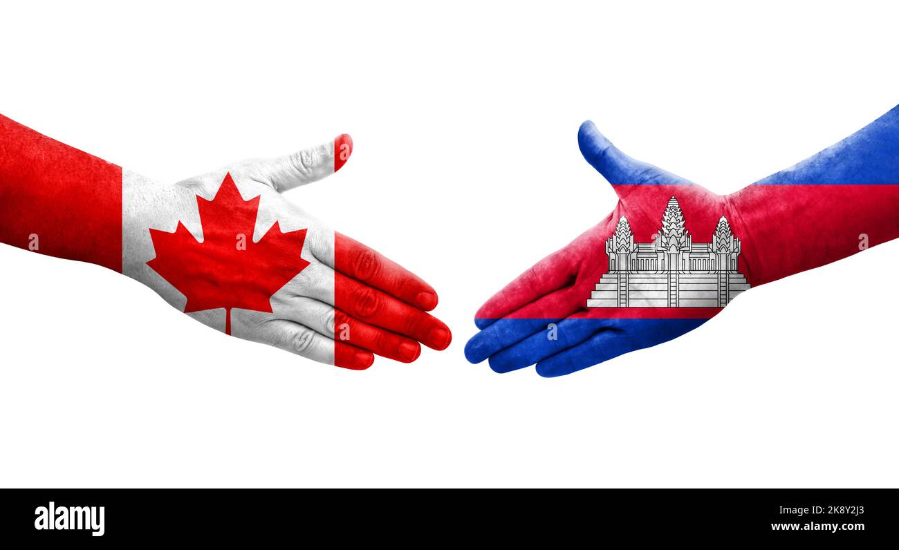 Handshake between Cambodia and Canada flags painted on hands, isolated ...