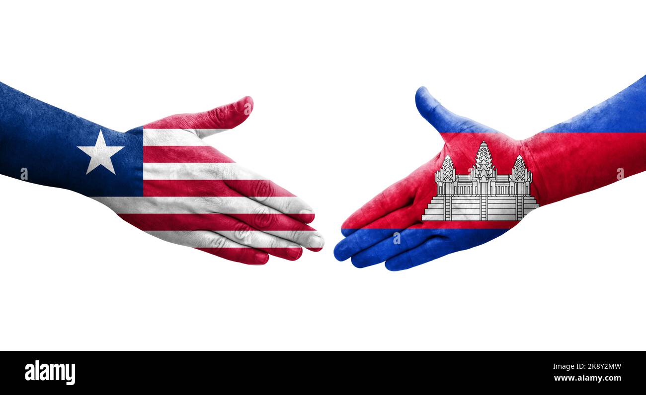 Handshake between Cambodia and Liberia flags painted on hands, isolated ...