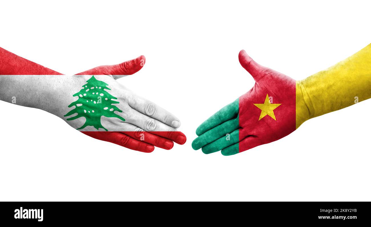 Handshake between Cameroon and Lebanon flags painted on hands, isolated ...