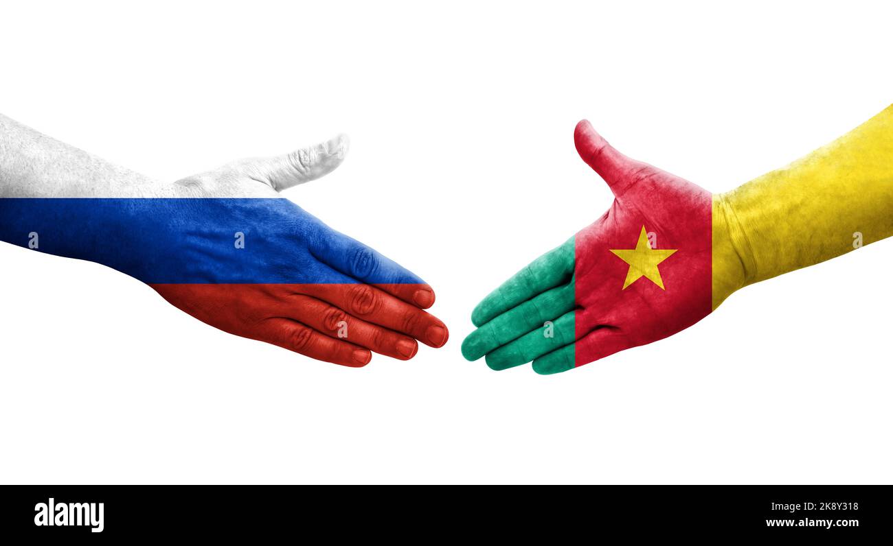 Handshake between Cameroon and Russia flags painted on hands, isolated ...