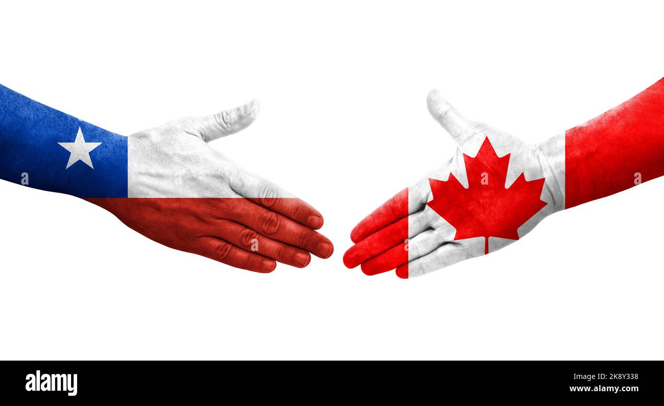 Handshake between Canada and Chile flags painted on hands, isolated ...