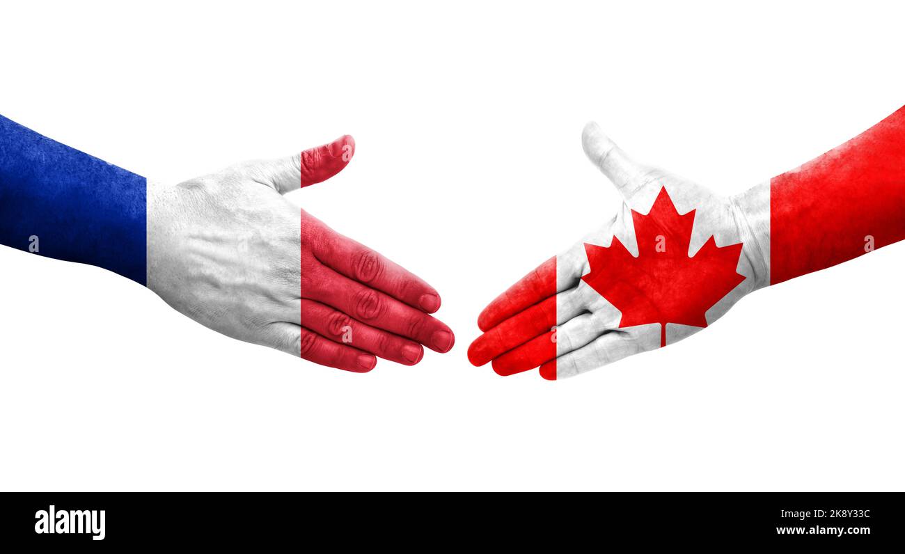 Handshake between Canada and France flags painted on hands, isolated ...