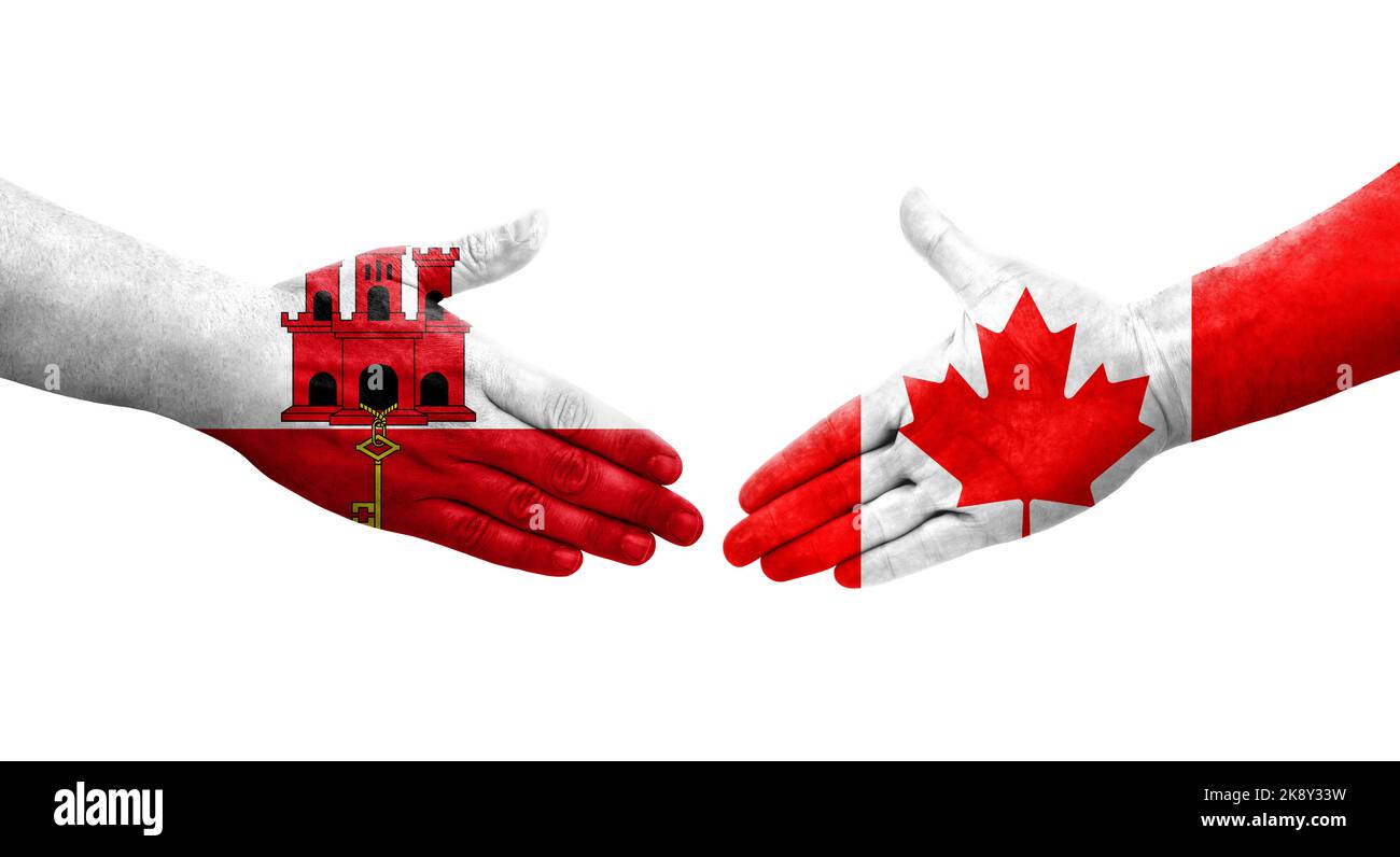 Handshake between Canada and Gibraltar flags painted on hands, isolated ...