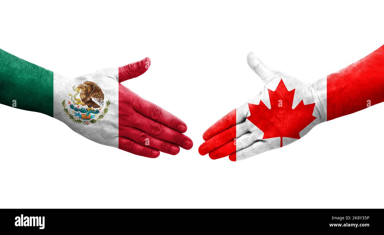 Handshake between Canada and Mexico flags painted on hands, isolated ...