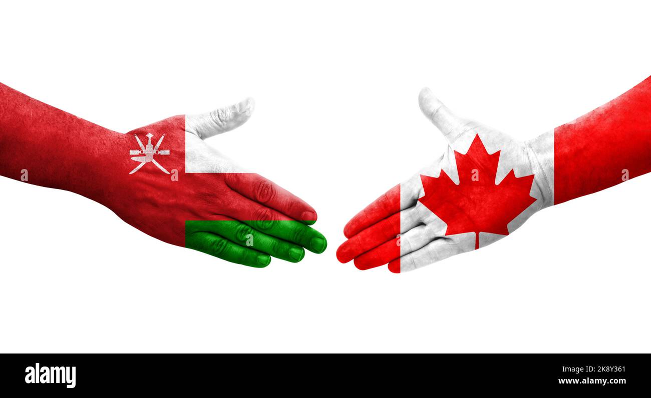 Handshake between Canada and Oman flags painted on hands, isolated ...