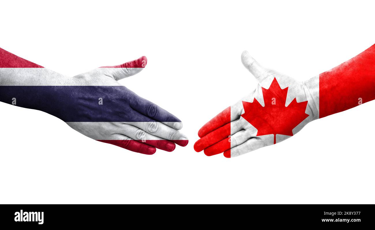 Handshake between Canada and Thailand flags painted on hands, isolated ...