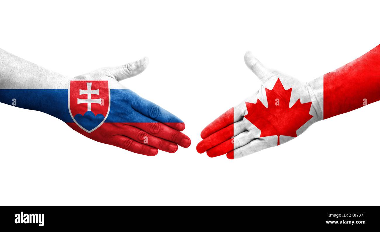 Handshake between Canada and Slovakia flags painted on hands, isolated ...
