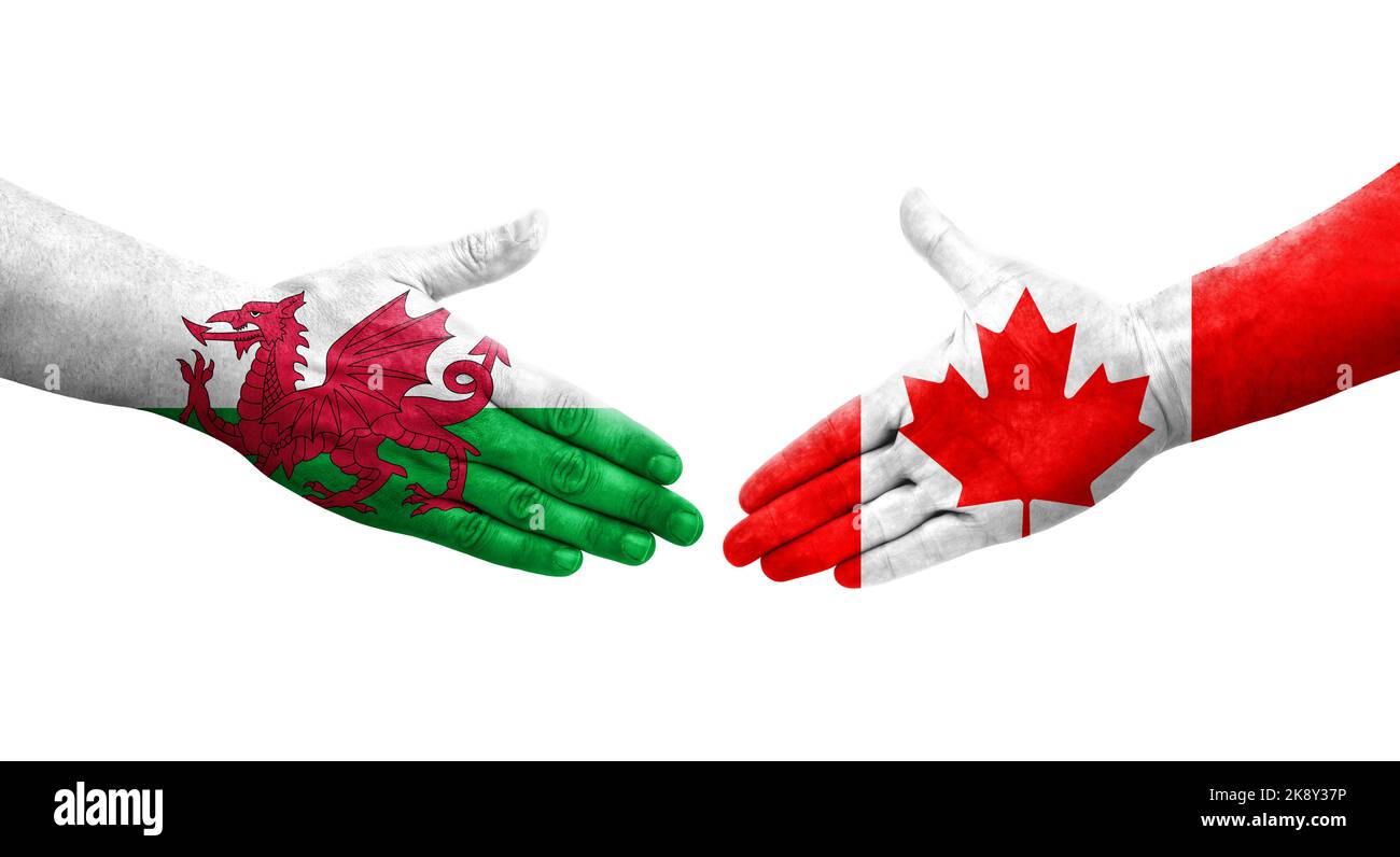 Handshake between Canada and Wales flags painted on hands, isolated ...