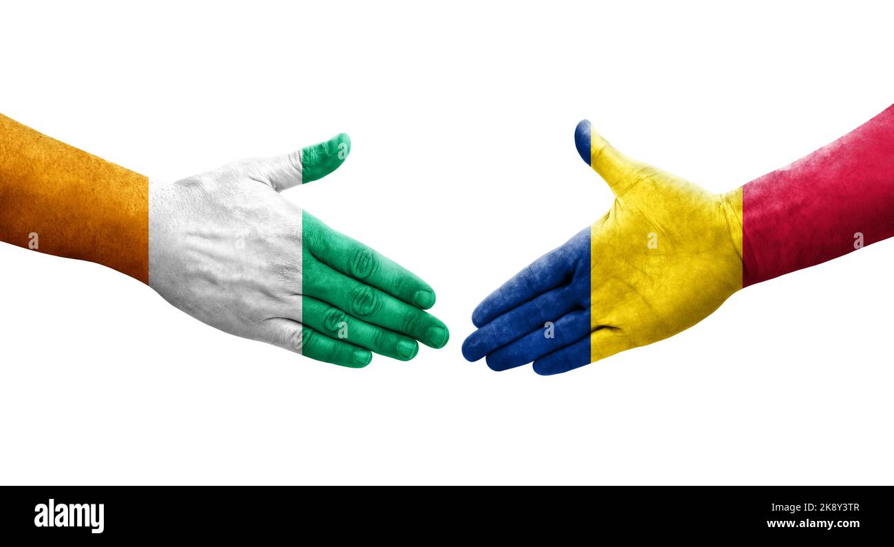 Handshake between Chad and Ivory Coast flags painted on hands, isolated ...
