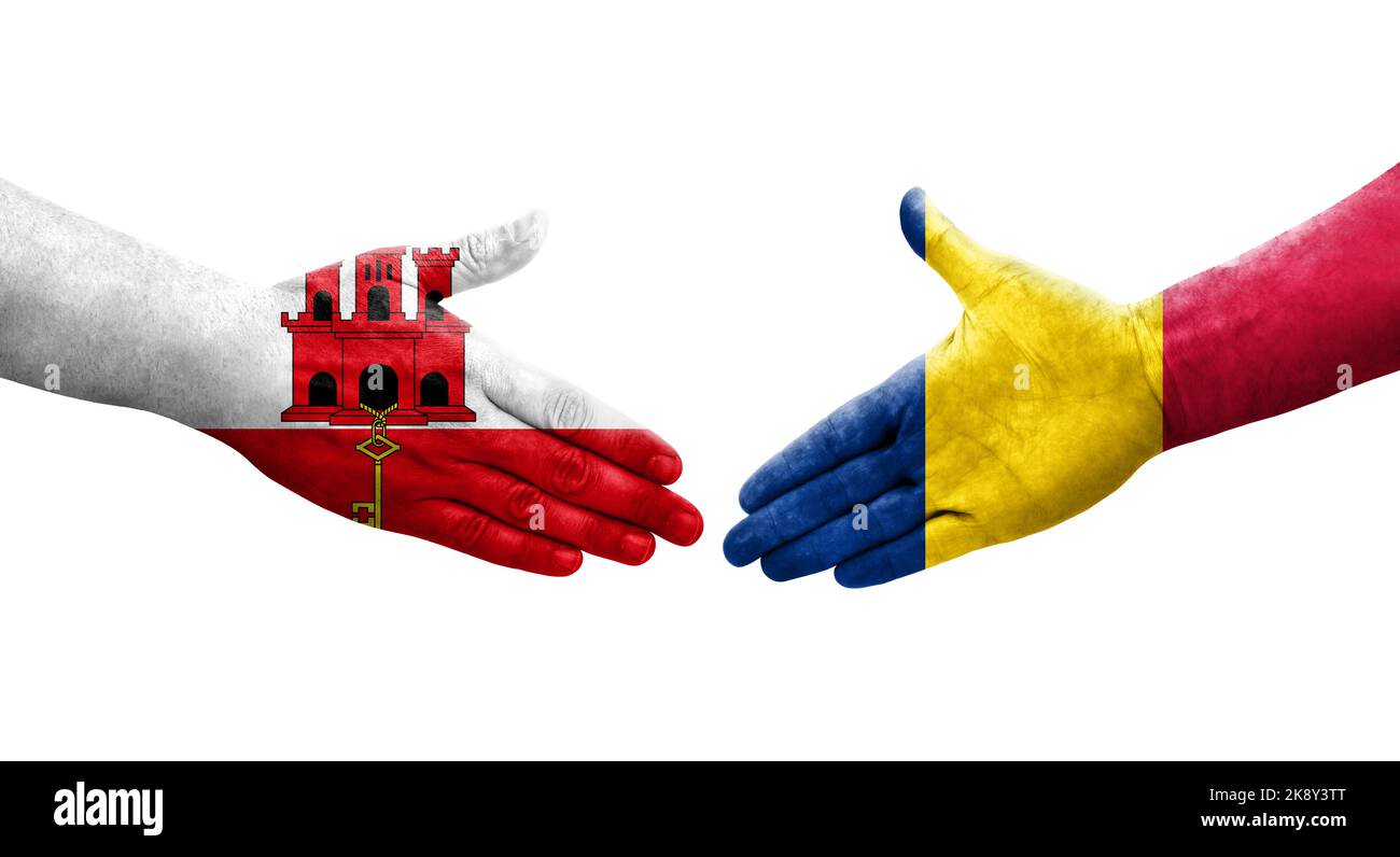 Handshake between Chad and Gibraltar flags painted on hands, isolated ...
