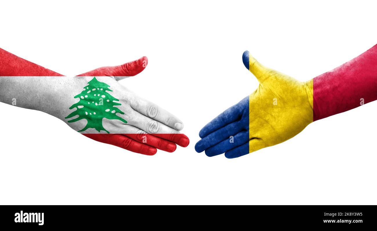 Handshake between Chad and Lebanon flags painted on hands, isolated ...