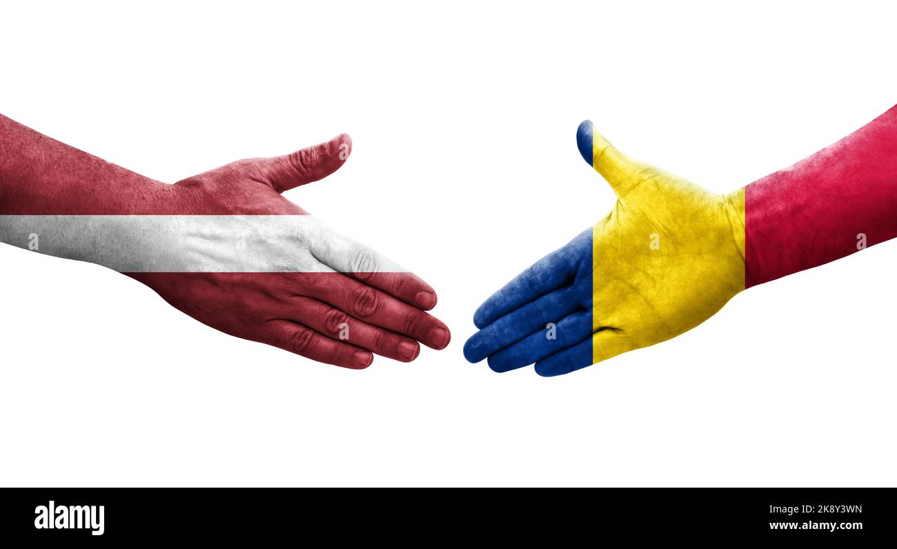 Handshake between Chad and Latvia flags painted on hands, isolated ...