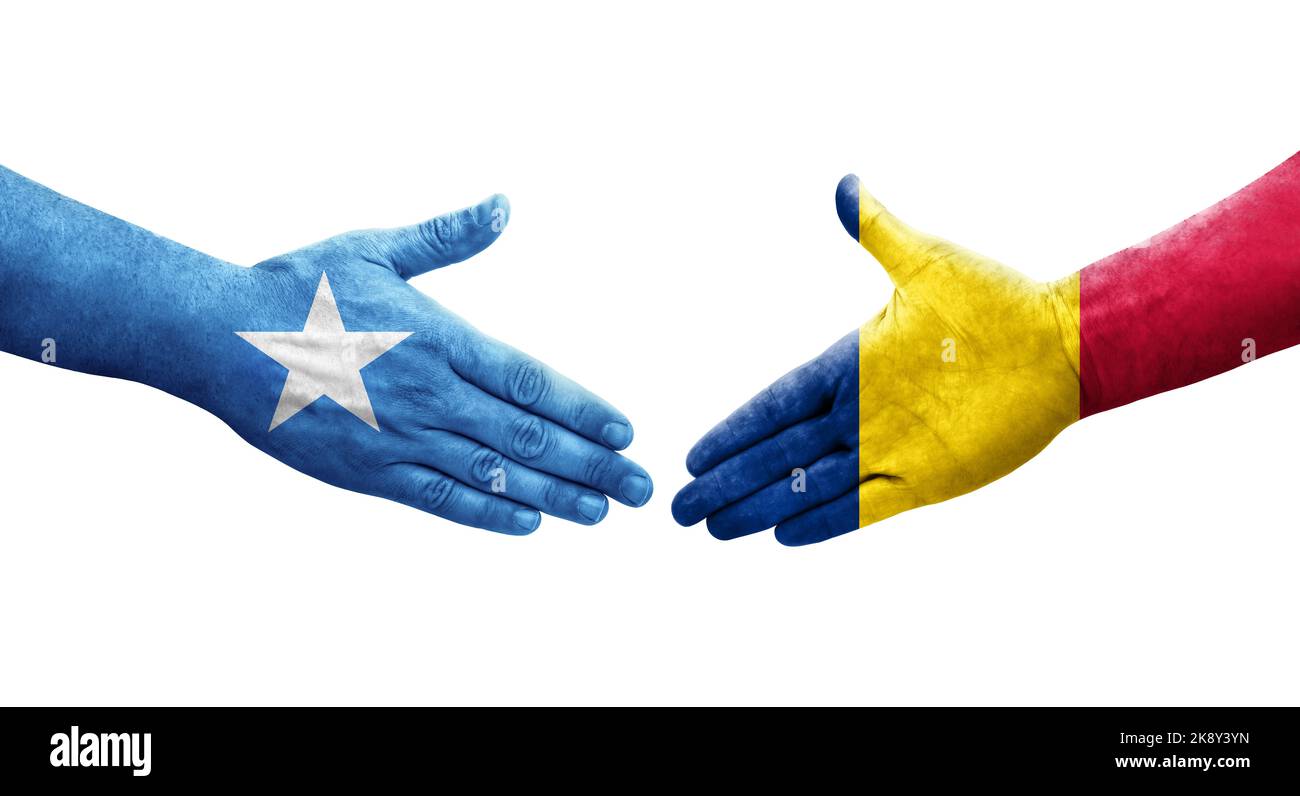 Handshake between Chad and Somalia flags painted on hands, isolated ...