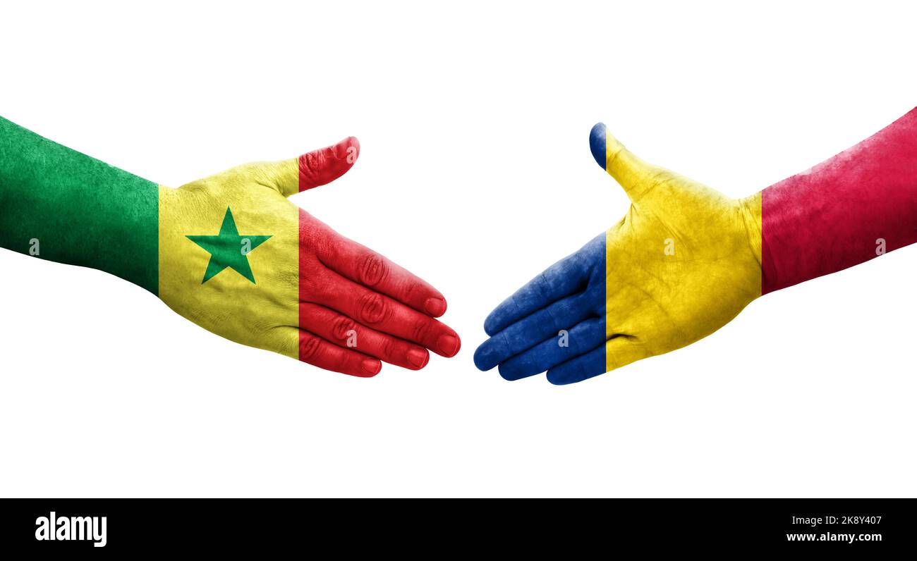 Handshake between Chad and Senegal flags painted on hands, isolated ...