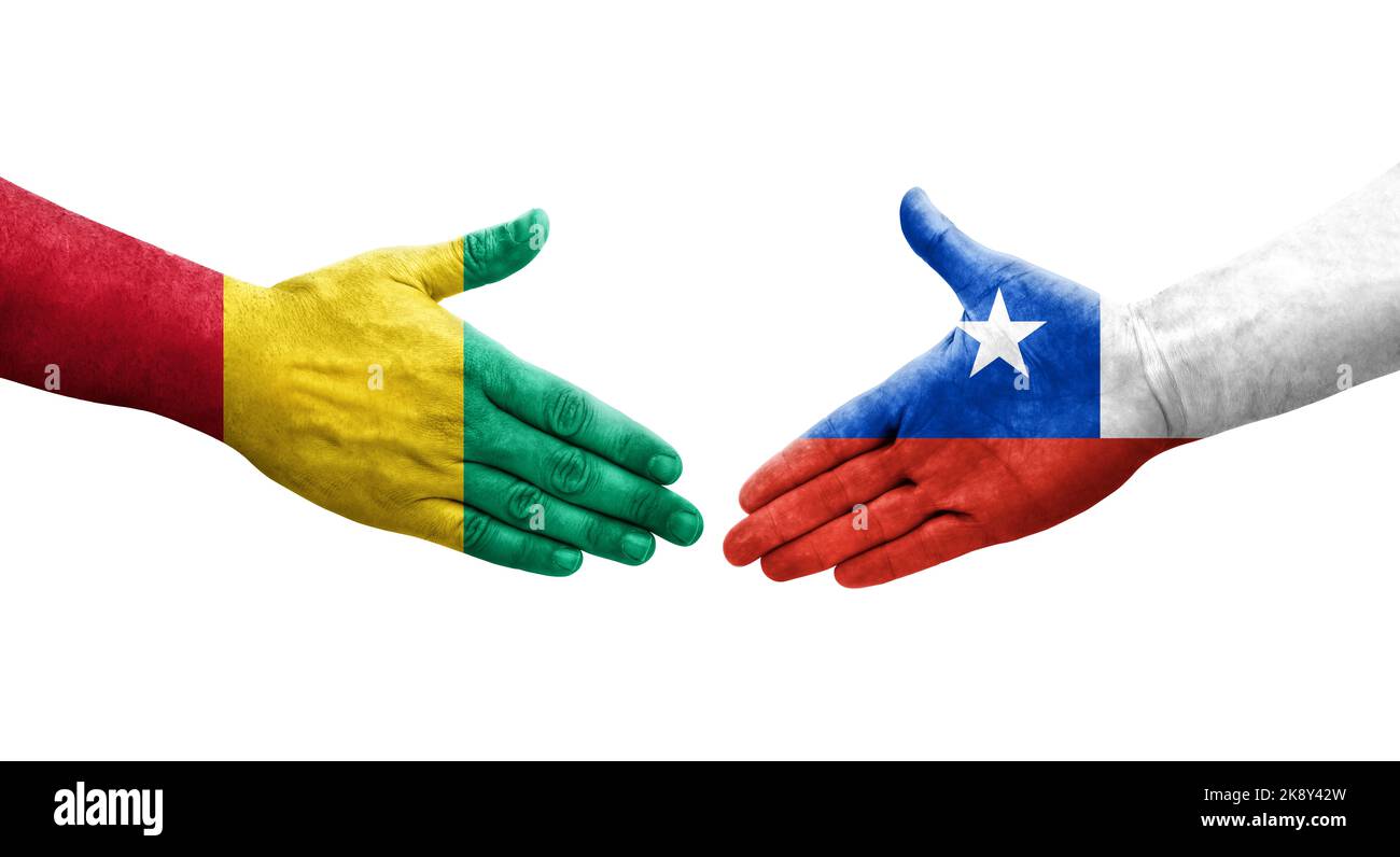 Handshake between Chile and Guinea flags painted on hands, isolated ...