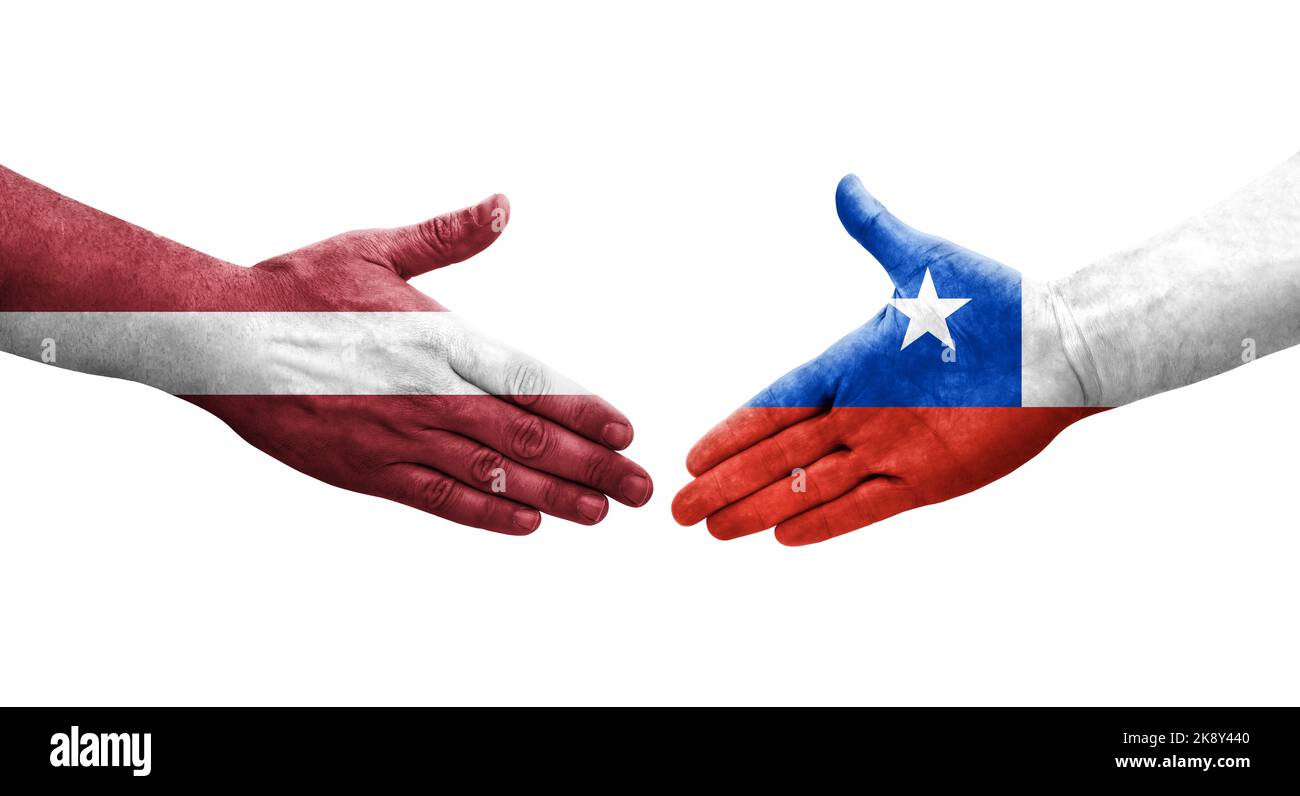 Handshake between Chile and Latvia flags painted on hands, isolated ...