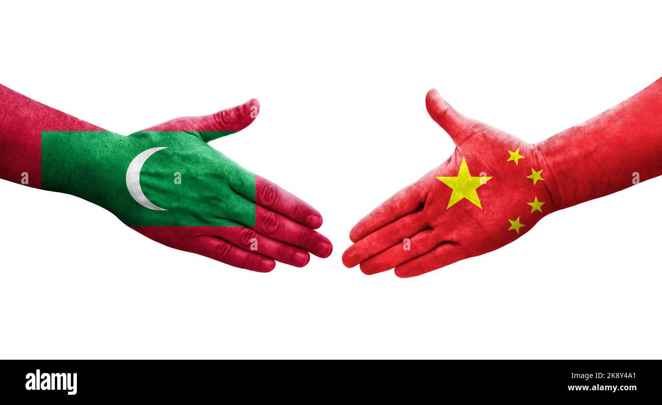 Handshake between China and Maldives flags painted on hands, isolated ...