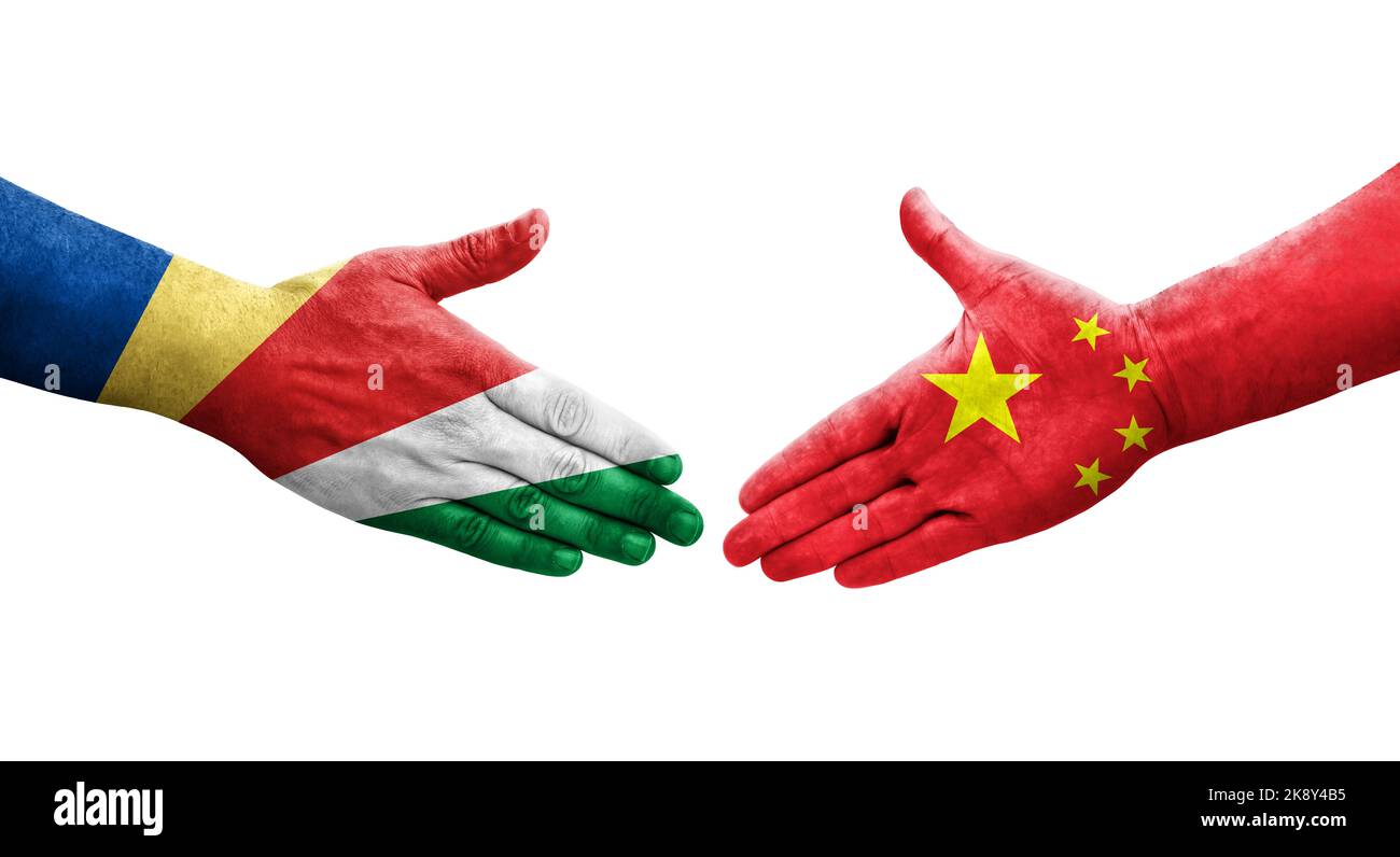 Handshake between China and Seychelles flags painted on hands, isolated ...