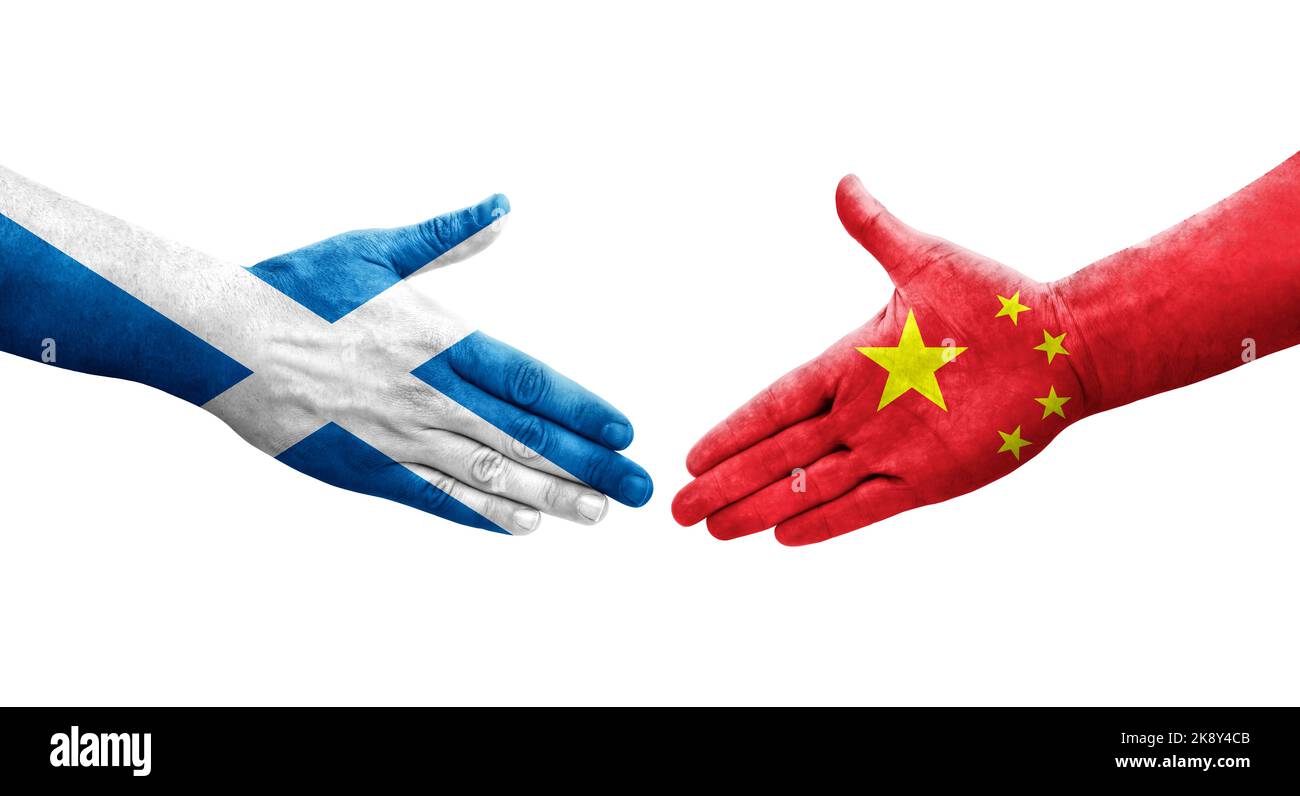 Handshake between China and Scotland flags painted on hands, isolated ...