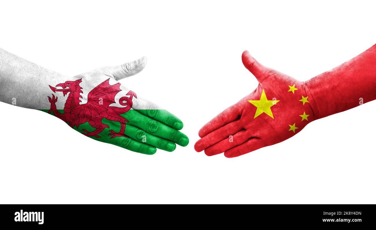 Handshake between China and Wales flags painted on hands, isolated ...