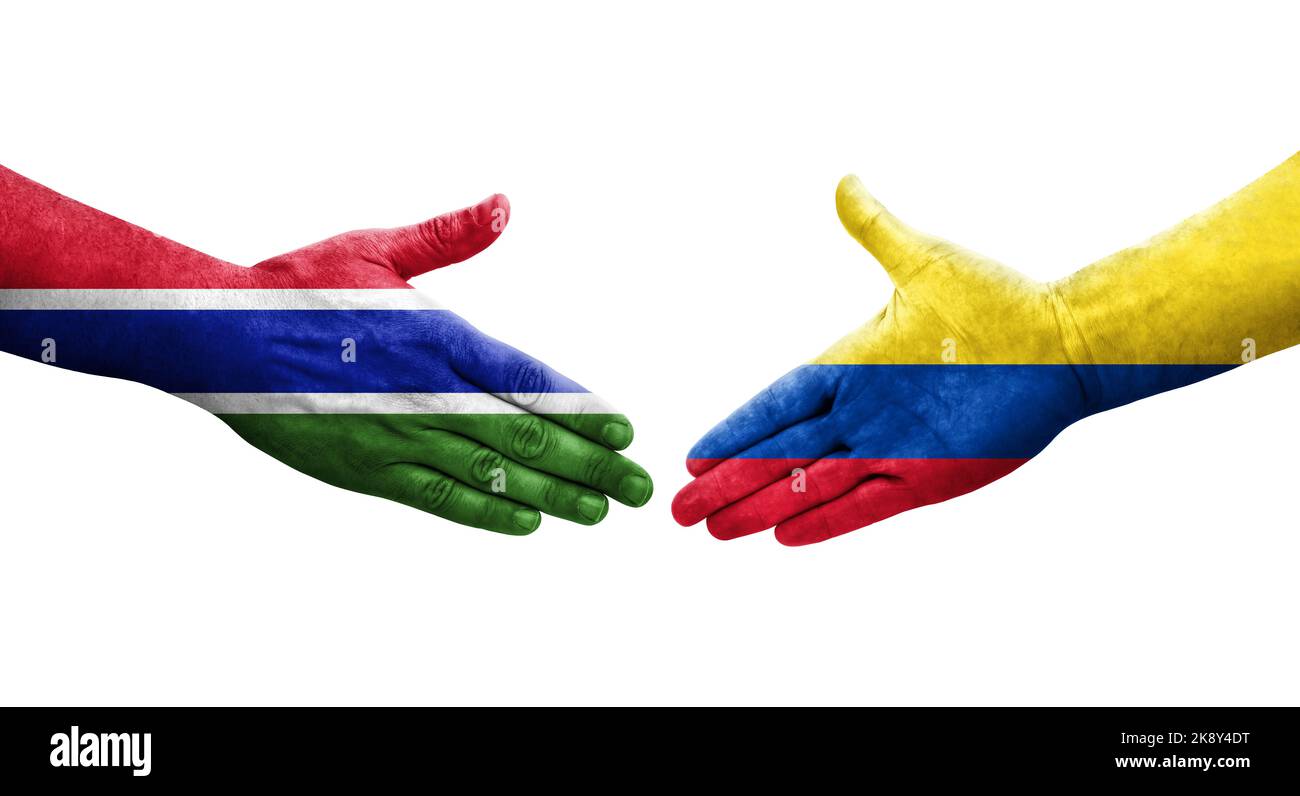 Handshake between Colombia and Gambia flags painted on hands, isolated ...