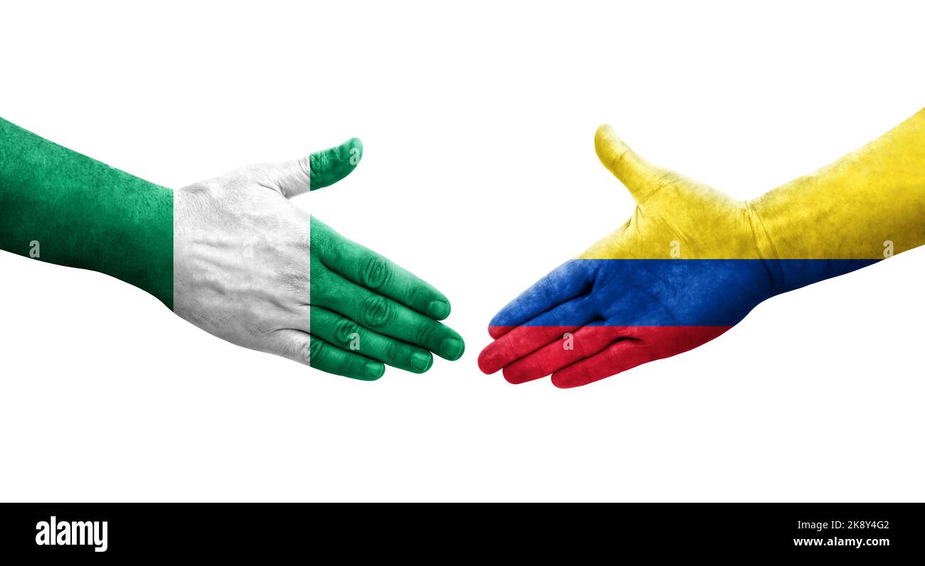 Handshake between Colombia and Nigeria flags painted on hands, isolated ...