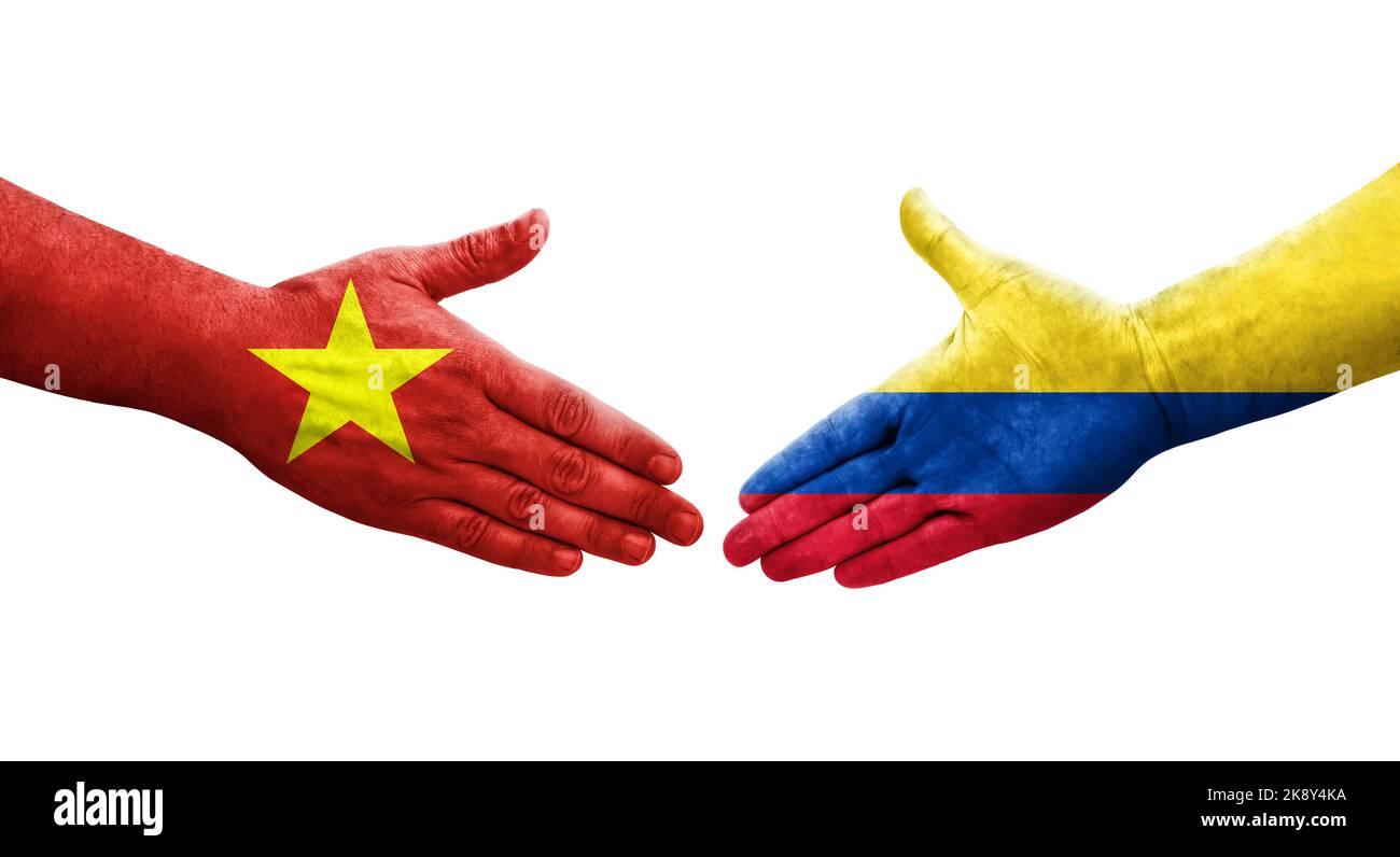 Handshake between Colombia and Vietnam flags painted on hands, isolated ...