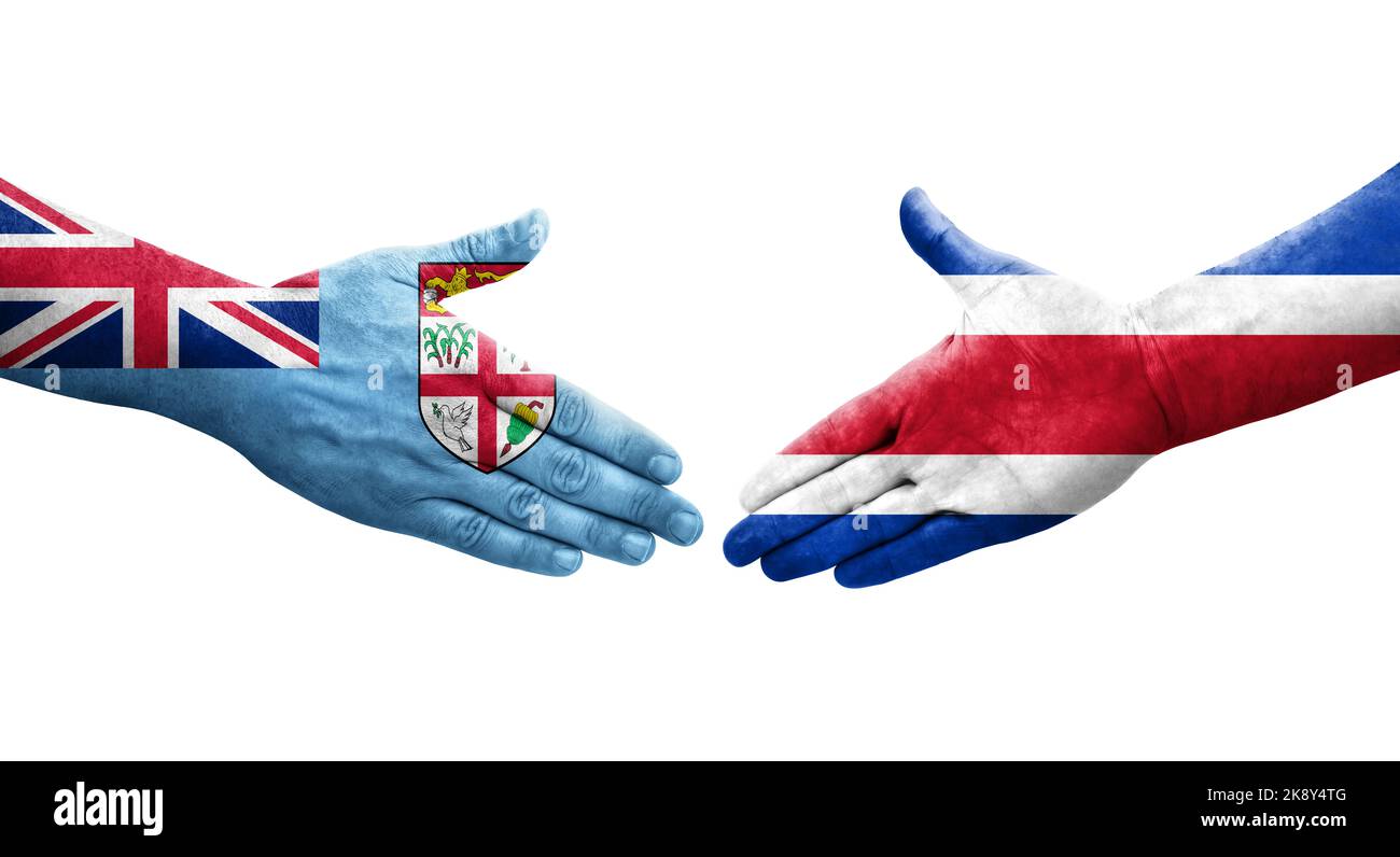 Handshake between Costa Rica and Fiji flags painted on hands, isolated ...
