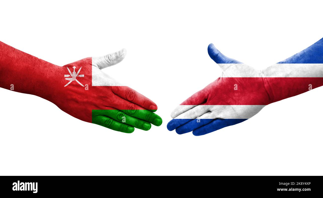 Handshake between Costa Rica and Oman flags painted on hands, isolated ...