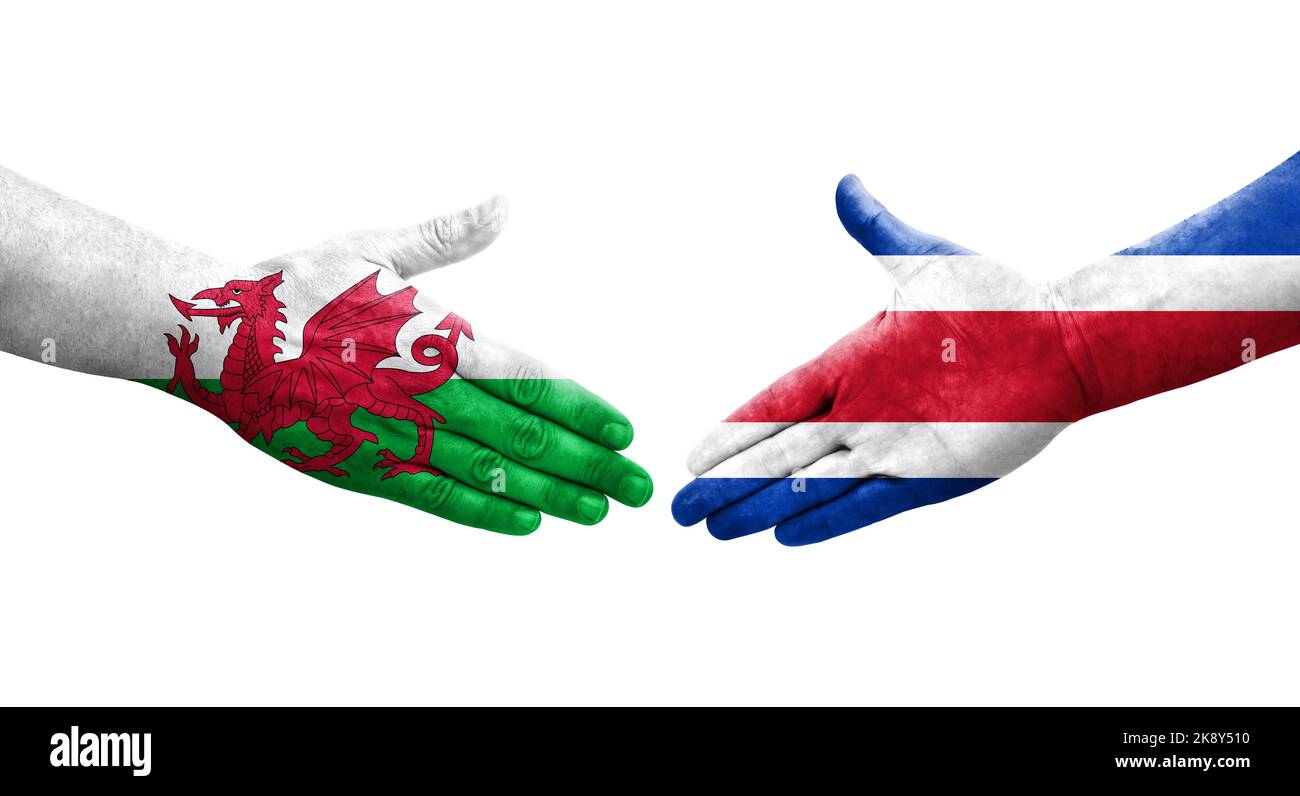 Handshake between Costa Rica and Wales flags painted on hands, isolated ...