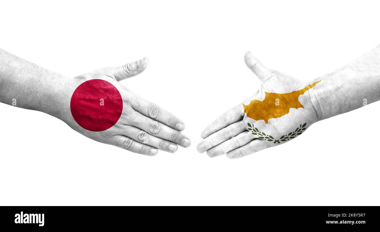 Handshake between Cyprus and Japan flags painted on hands, isolated ...