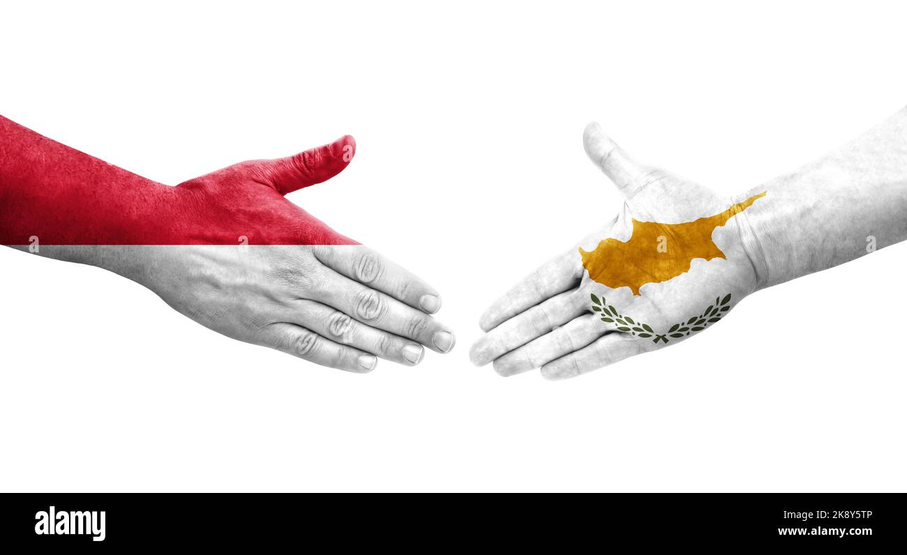 Handshake between Cyprus and Monaco flags painted on hands, isolated ...