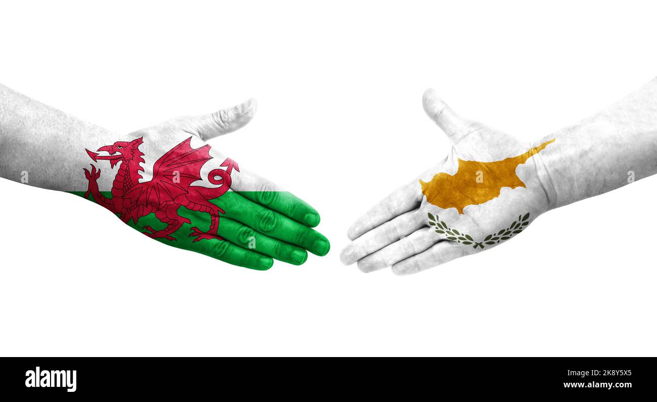 Handshake between Cyprus and Wales flags painted on hands, isolated ...