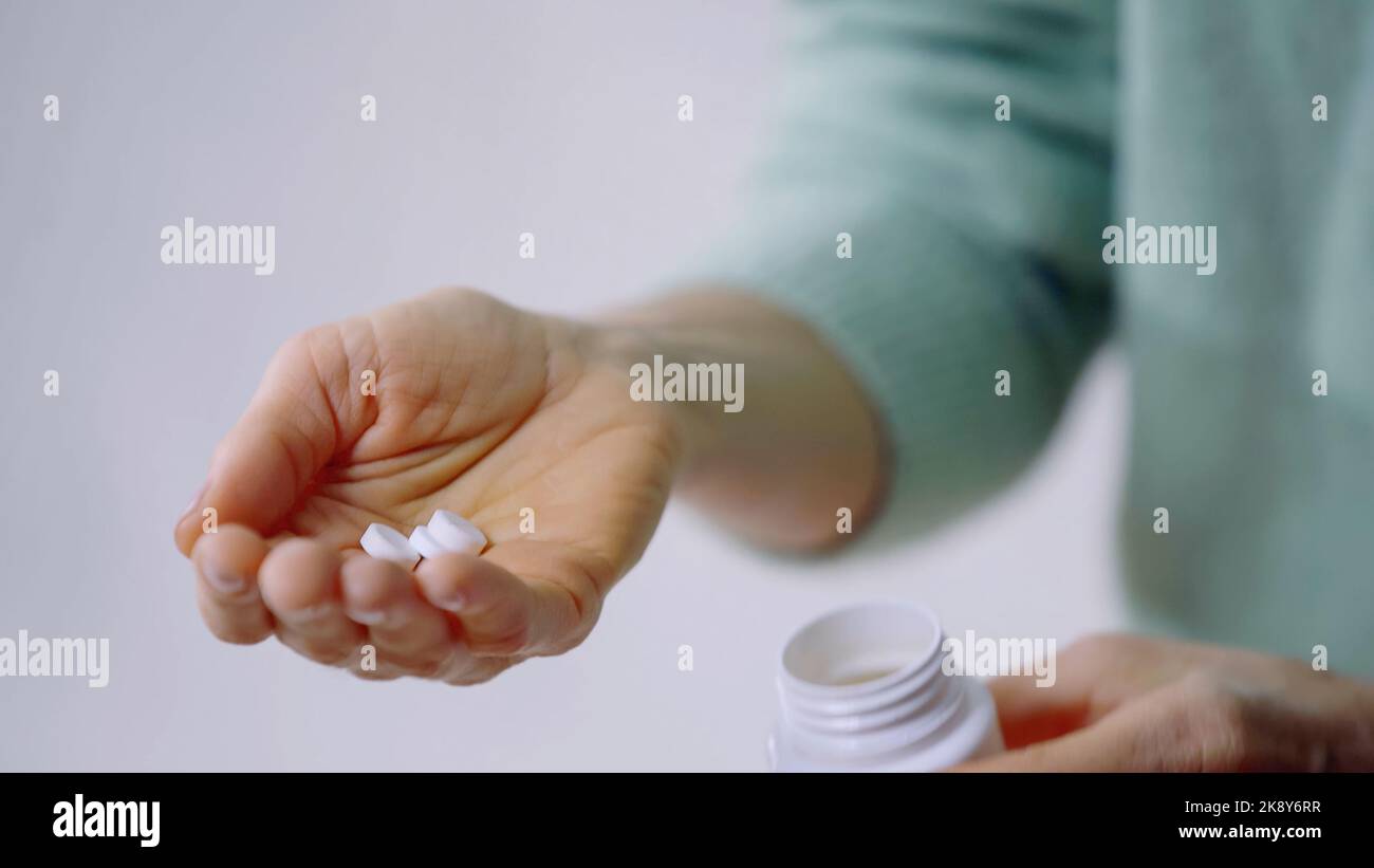 Home medicine hands person hi-res stock photography and images - Alamy