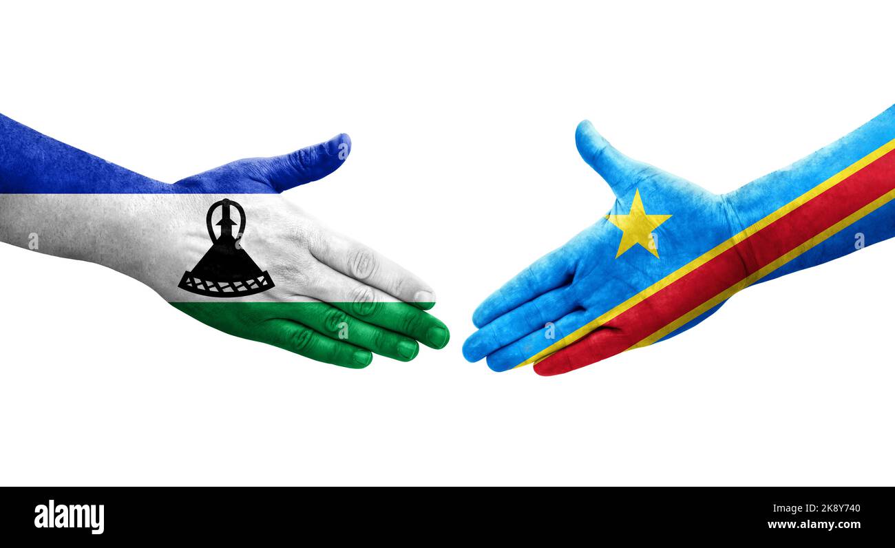 Handshake between Dr Congo and Lesotho flags painted on hands, isolated ...